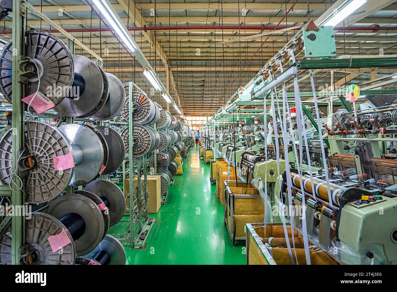 Elastic weaving workshop at textile factory in industrial zone in Ho ...