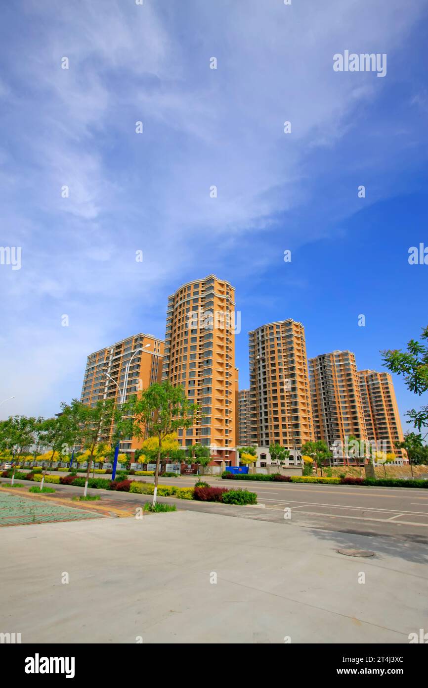 High-rise building under the blue sky, city scenery Stock Photo - Alamy