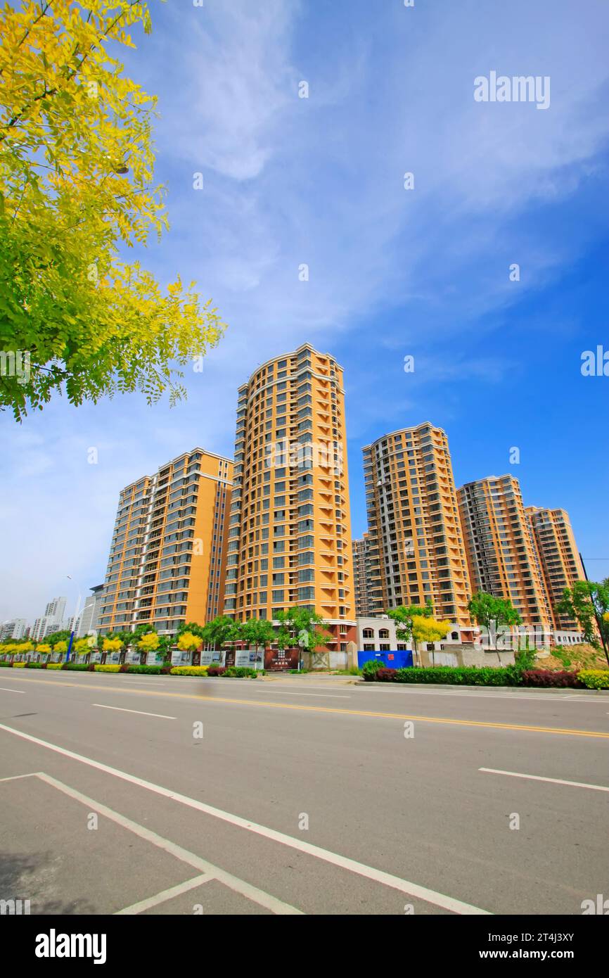 High-rise building under the blue sky, city scenery Stock Photo - Alamy
