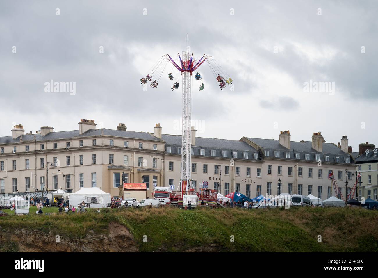Visitors enjoying a fairground ride at Whitby regatta Stock Photo - Alamy