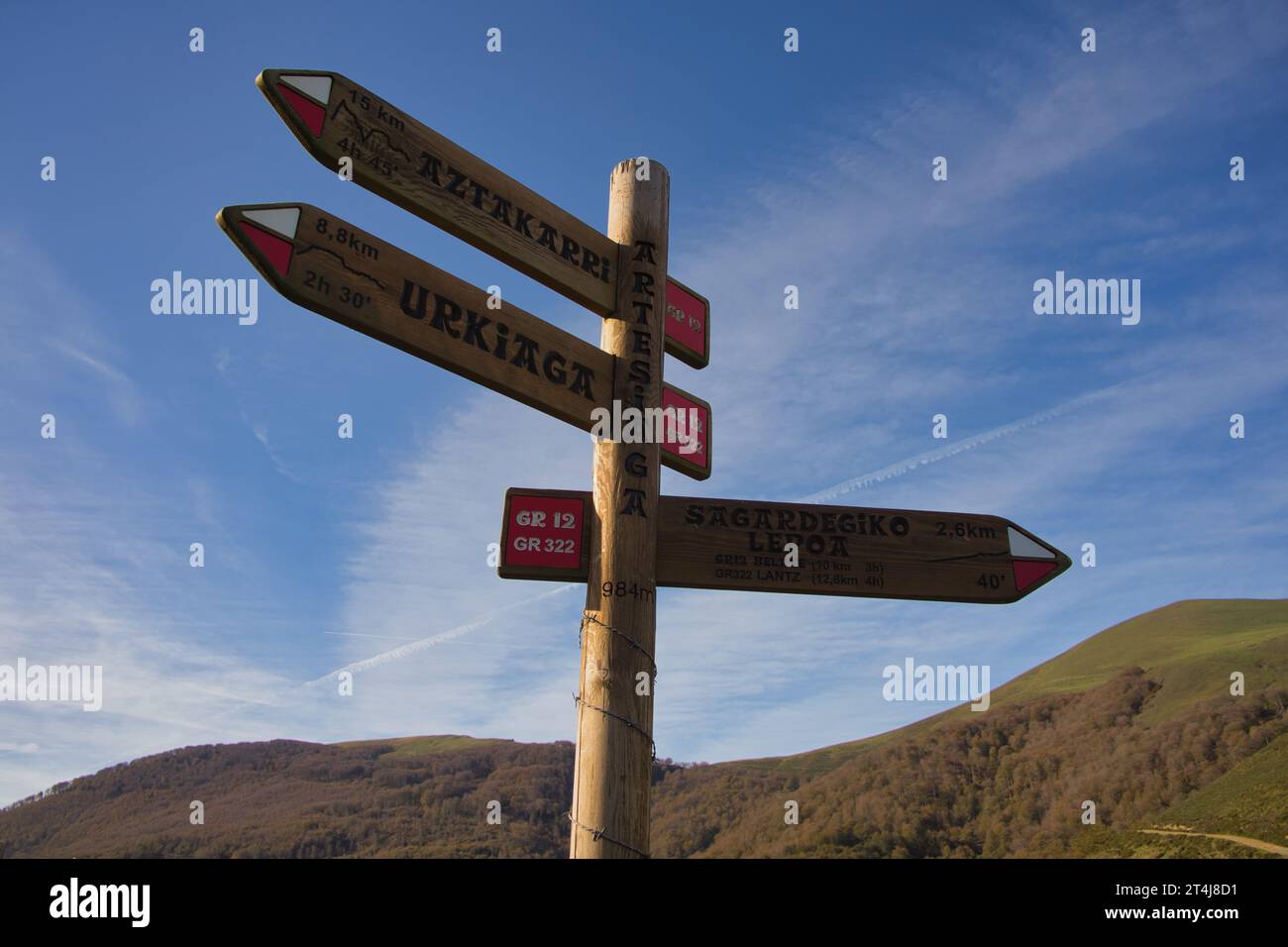 Trail markers and hiking posts indicating the direction to follow on a ...