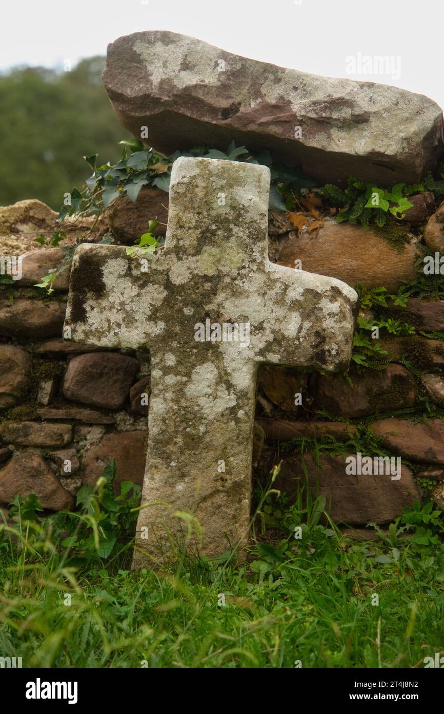Stone cross in an Irish cemetery, in daylight, space for text copy ...