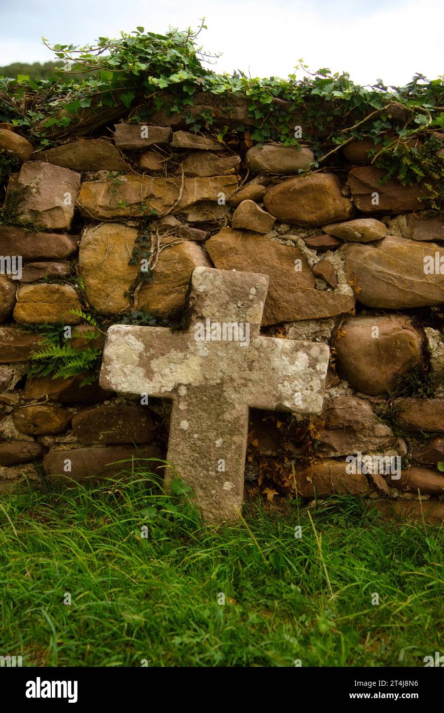 Solitary stone cross in a rural cemetery, suitable for any project ...