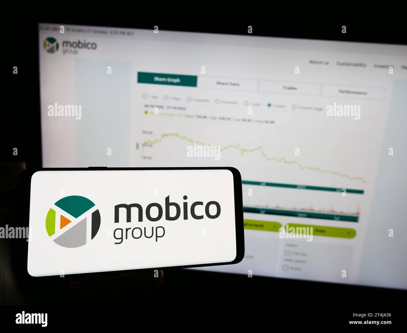 Person holding mobile phone with logo of British public transport ...