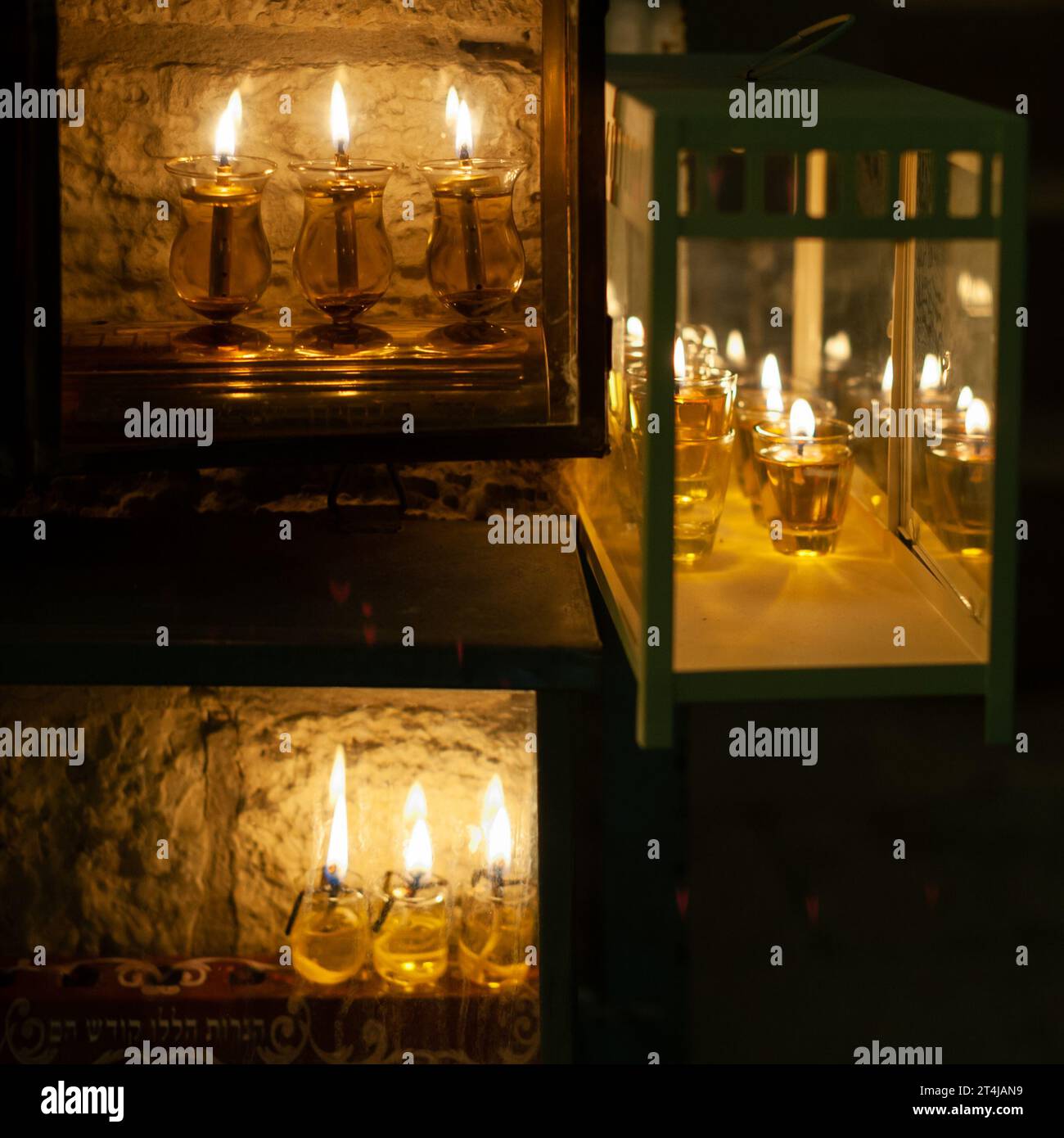 Oil lights from multiple Hanukkah menorahs in Israel, where it is ...