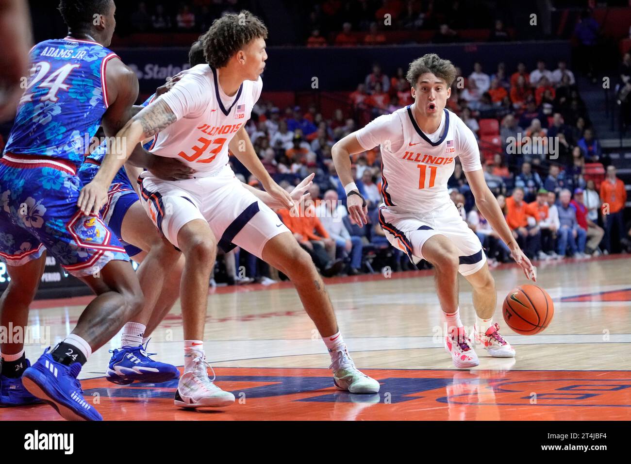 Illinois guard Niccolo Moretti drives to the basket around a double ...