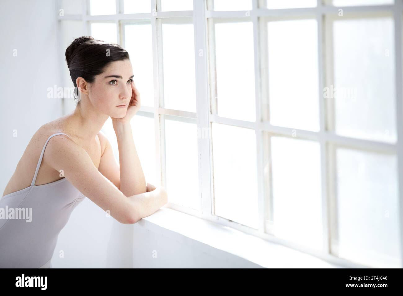 Woman, ballet dancer and thinking at window for future creative ...