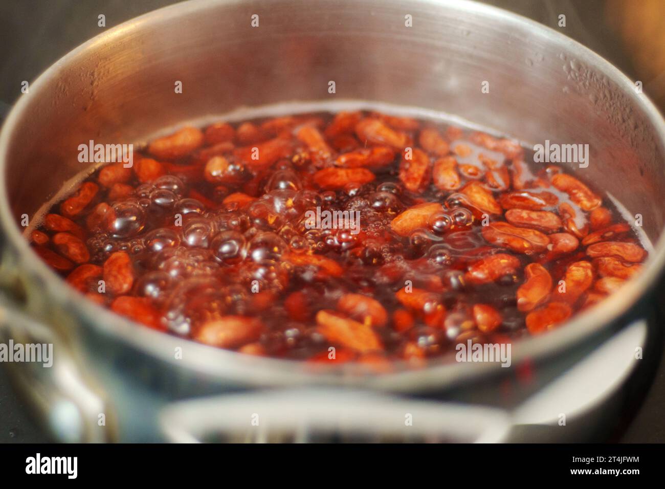 Boiled beans in boiling water close-up. Cooking homemade veggie food ...