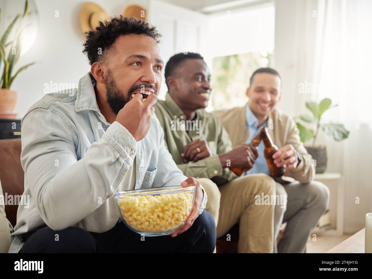 We enjoying a good movie night now and then. three male friends ...