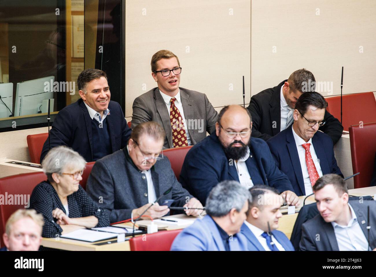 31 October 2023, Bavaria, Munich: Daniel Halemba (AfD) sits on a chair ...