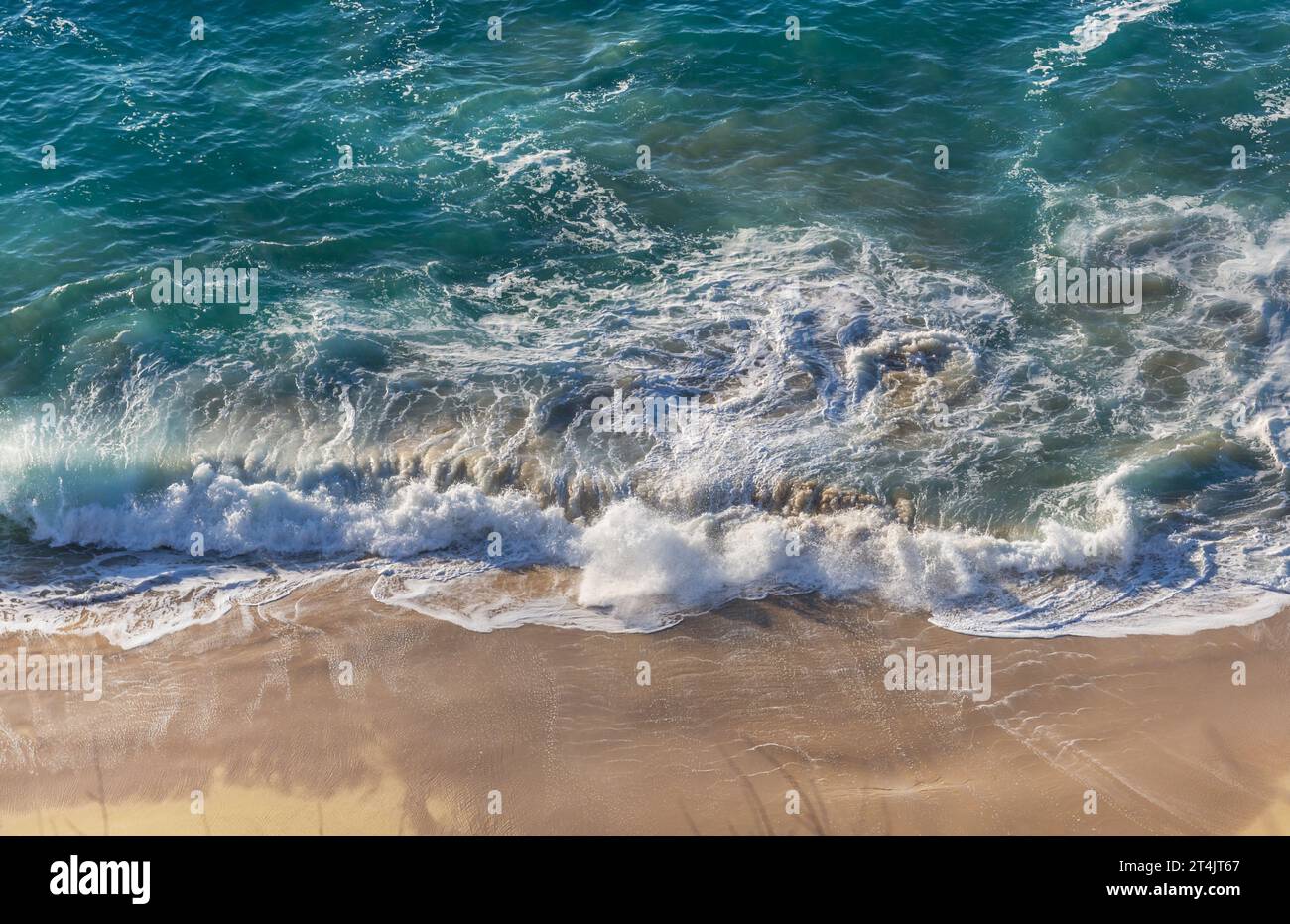 Blue wave on the beach. Dramatic natural background Stock Photo - Alamy