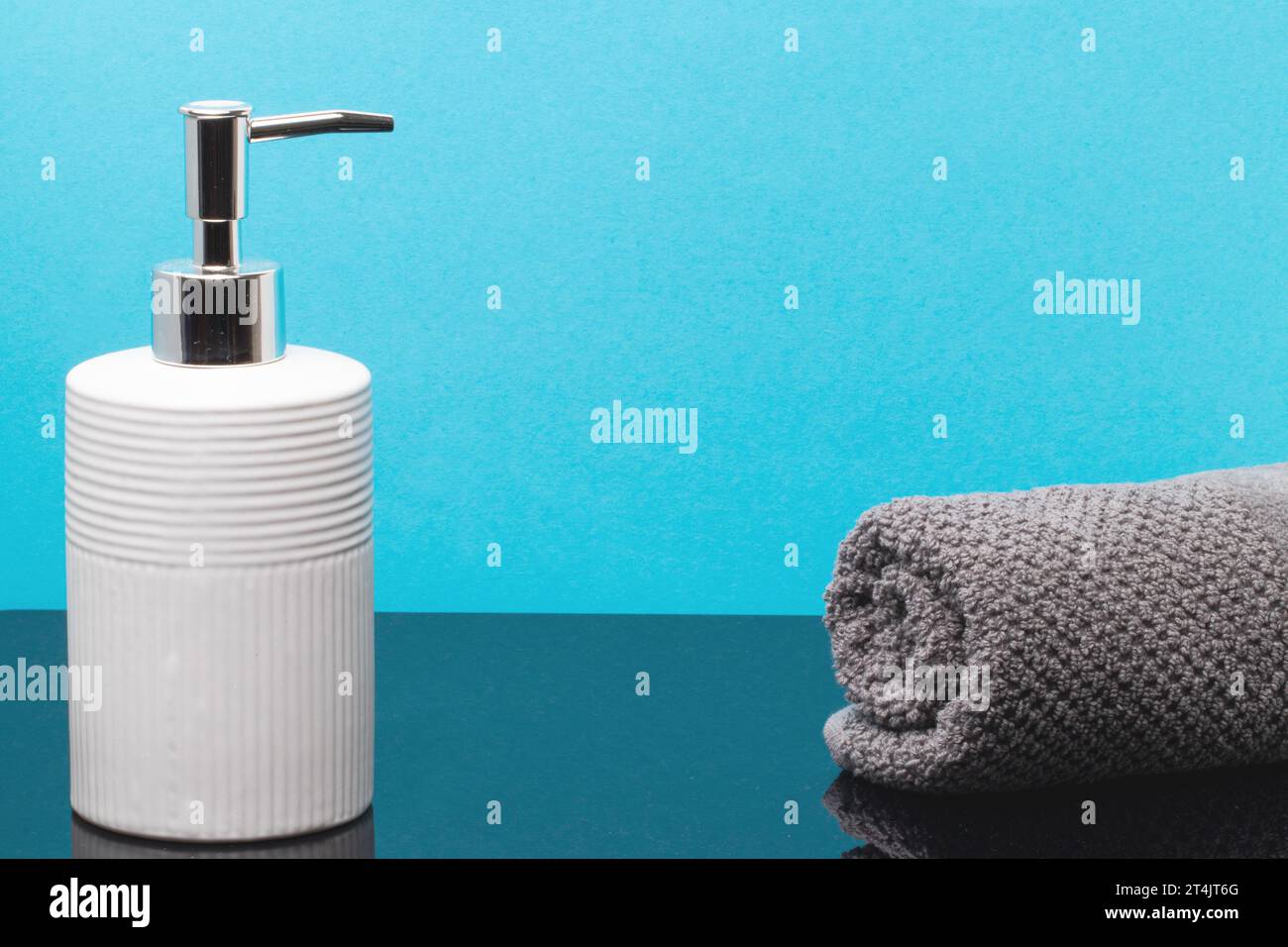 Macro of a beauty cosmetic makeup bottle and a fresh soft terry bath ...