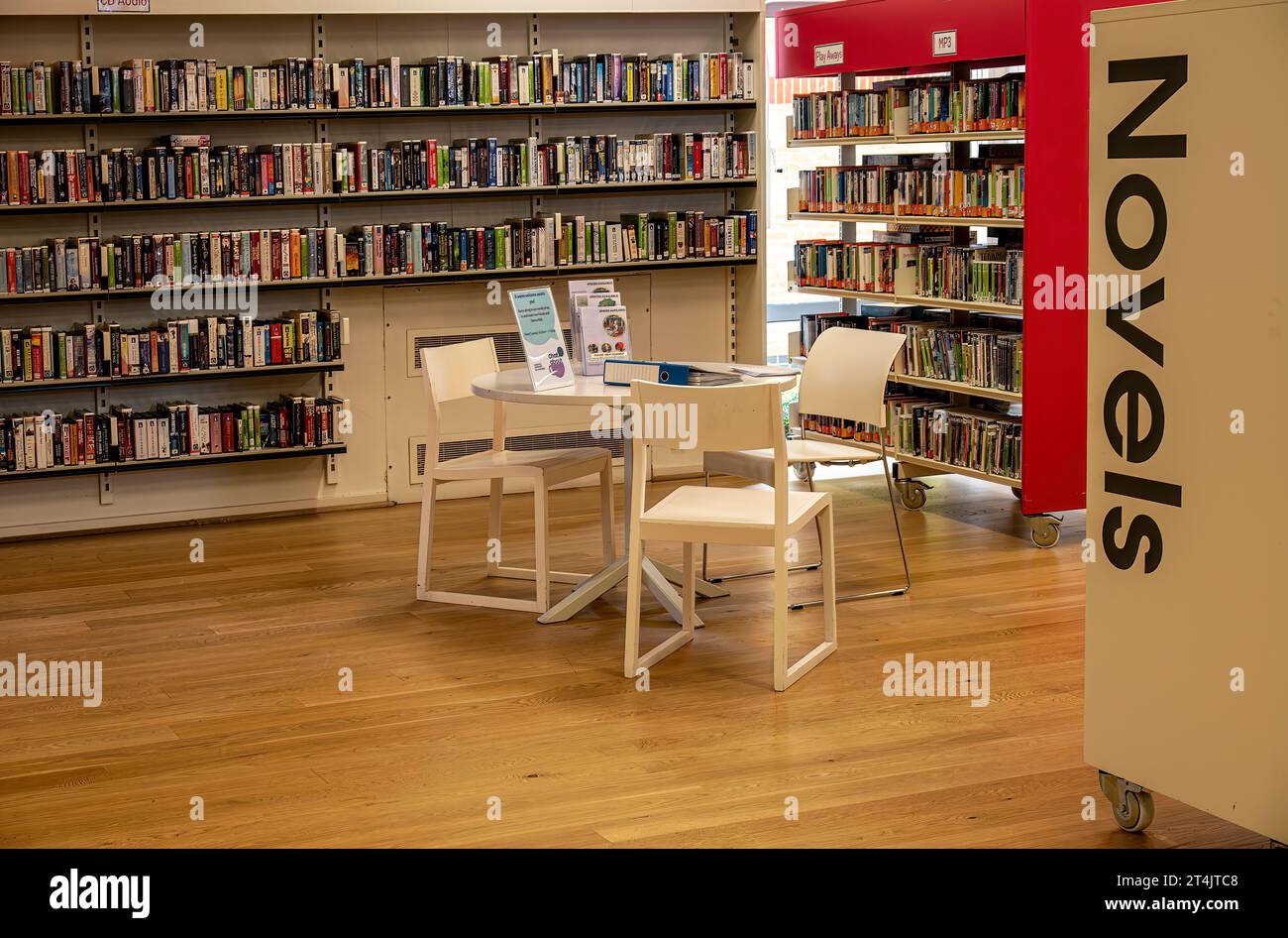 Colourful book shelves in a public library Stock Photo - Alamy