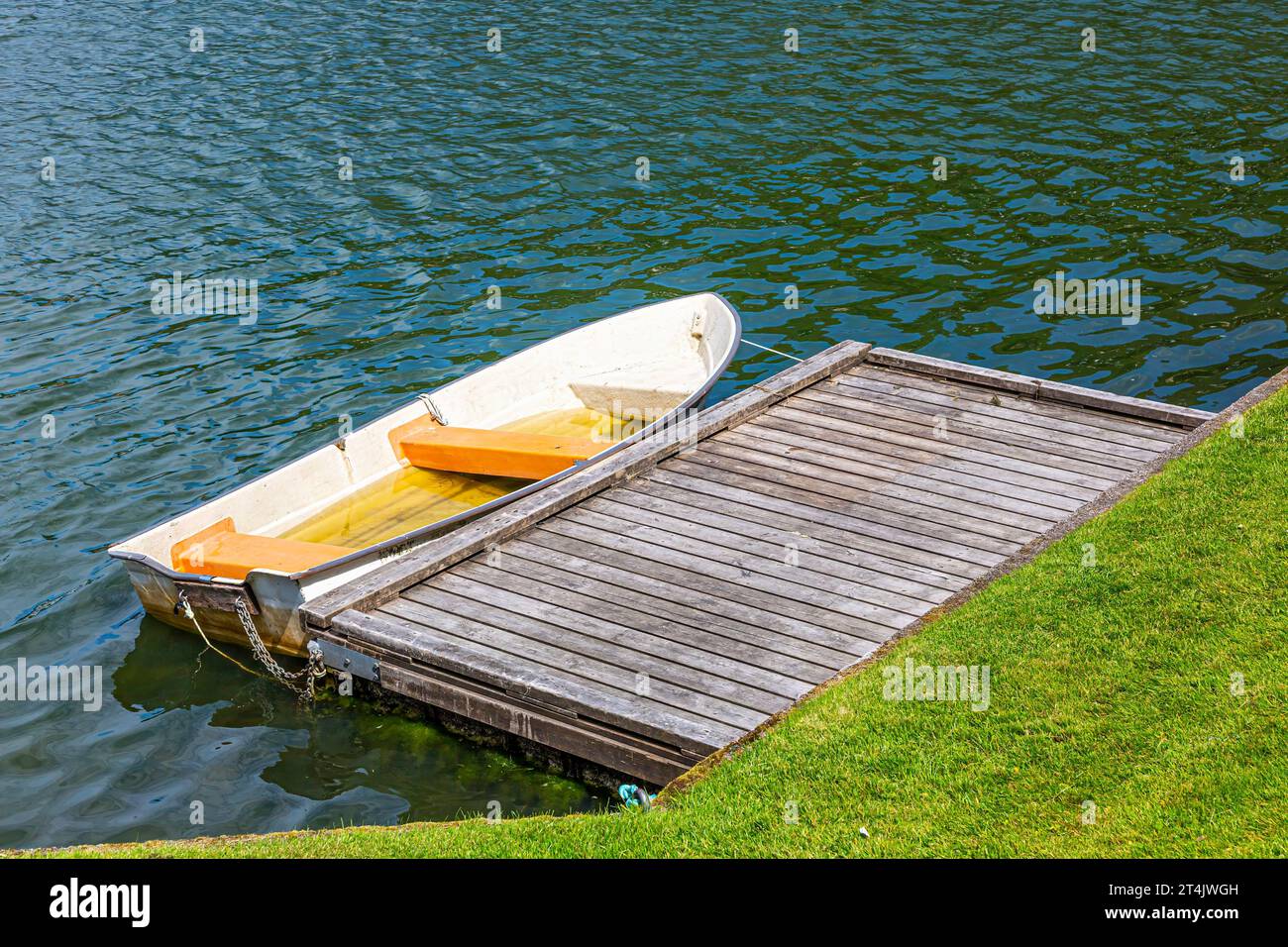 Impression of small rowboat at pier Stock Photo - Alamy