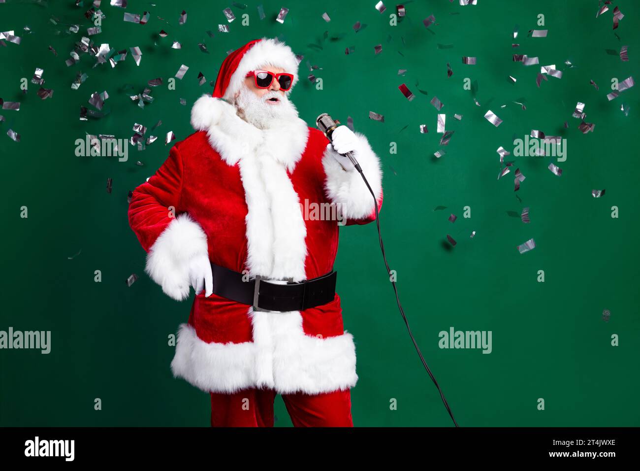 Photo of positive funky santa dressed red costume singing new year ...