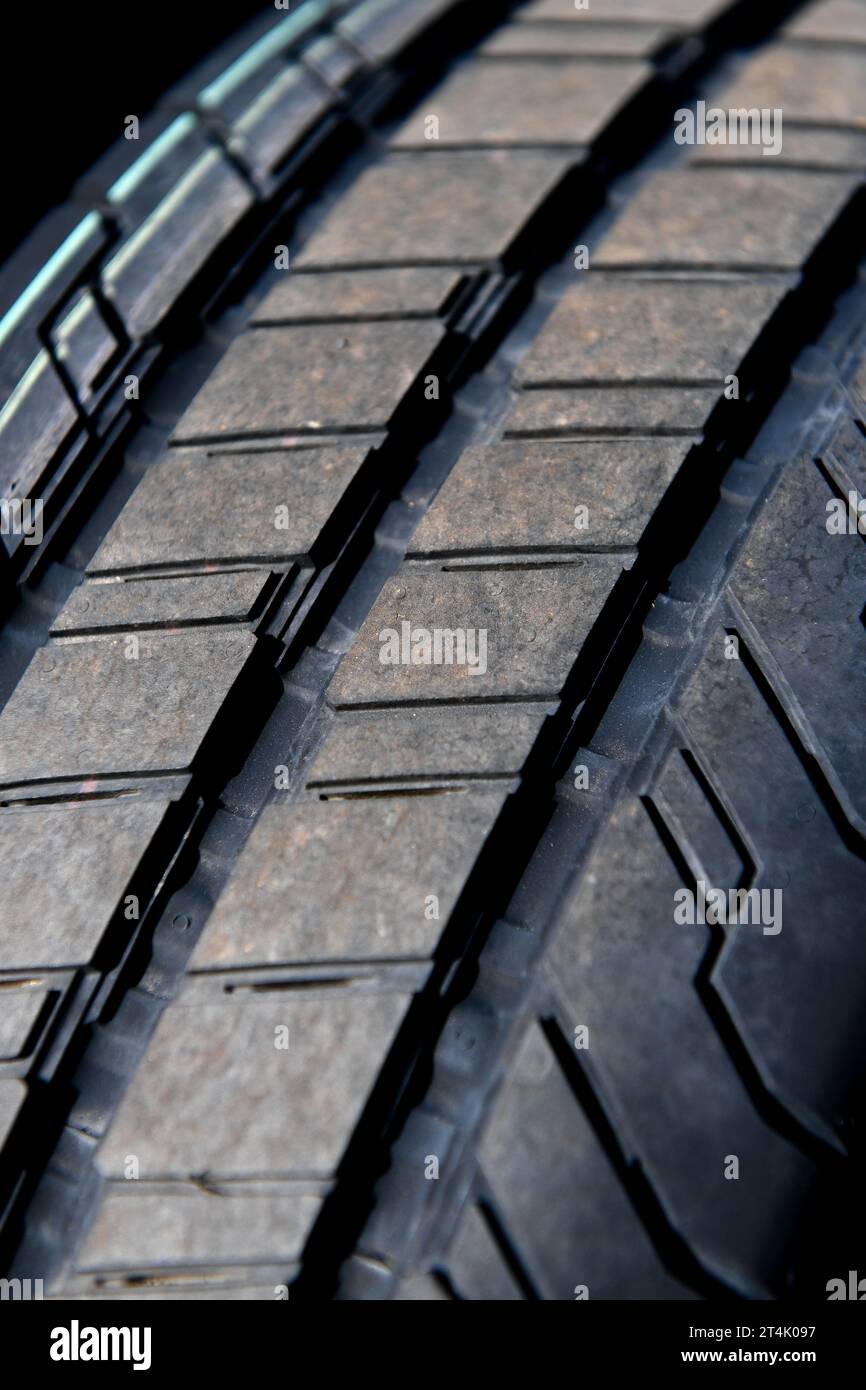 Close up of new truck tyres showing deep tread pattern and safety ...