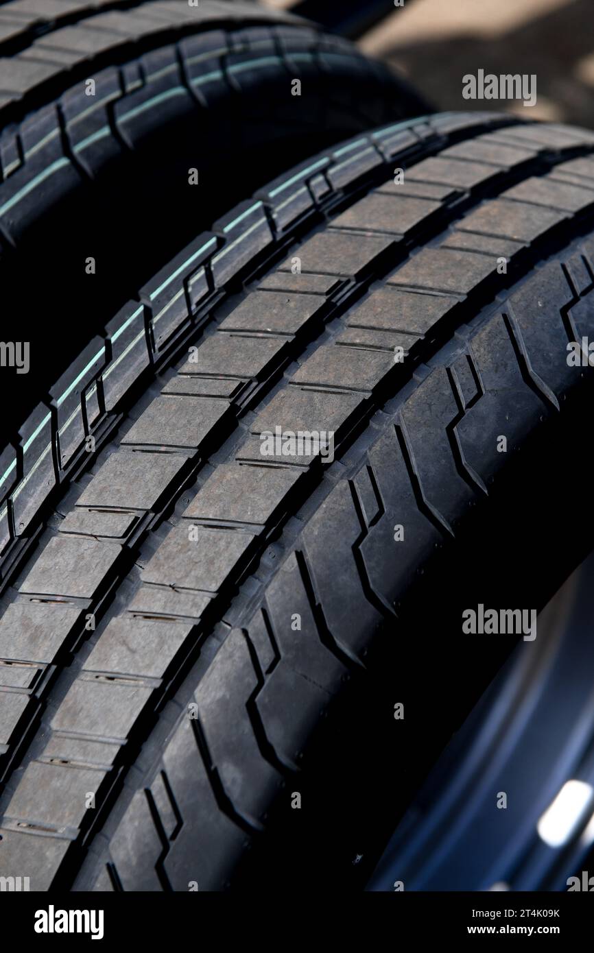 Close up of new truck tyres showing deep tread pattern and safety ...