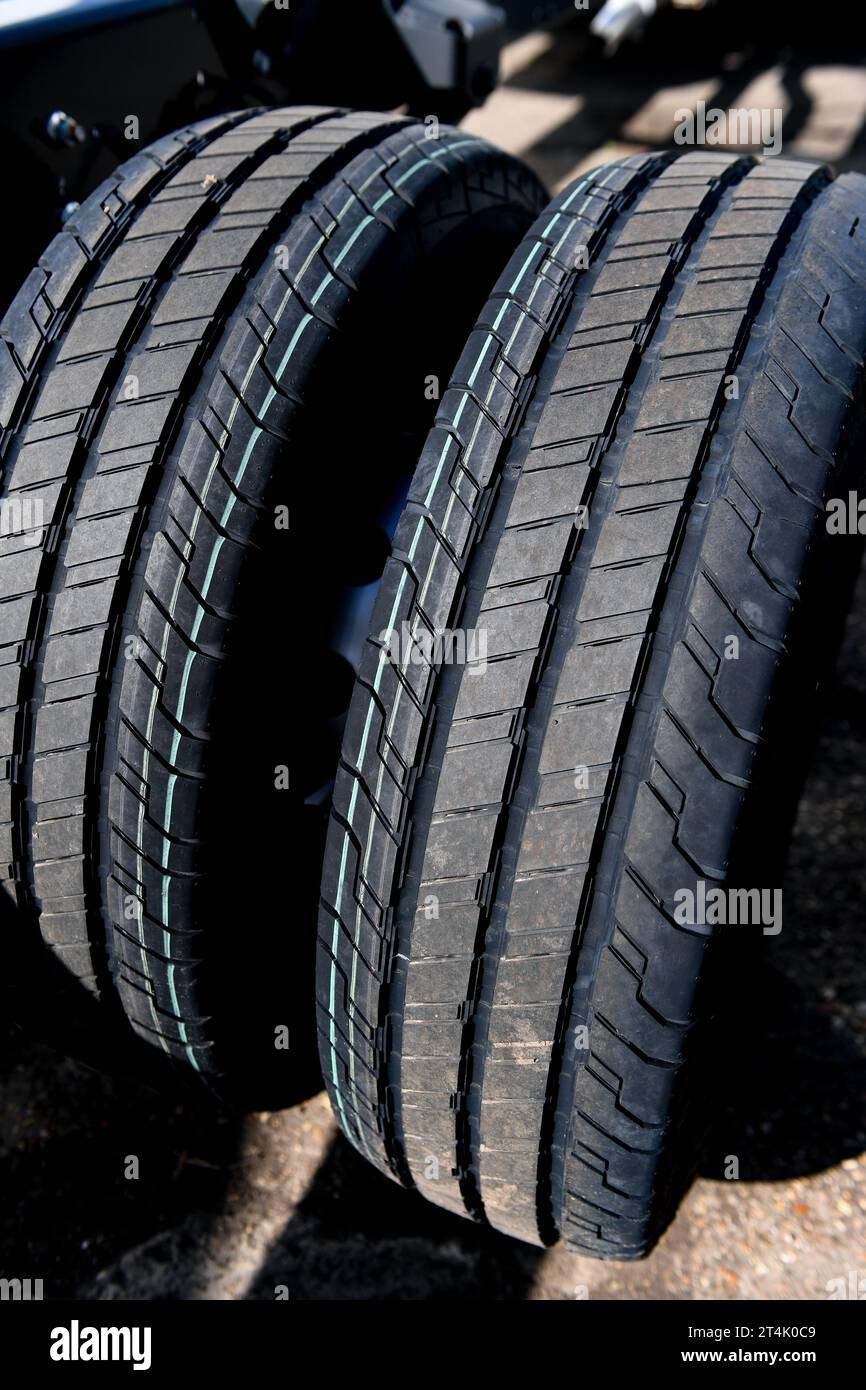 Close up of new truck tyres showing deep tread pattern and safety ...