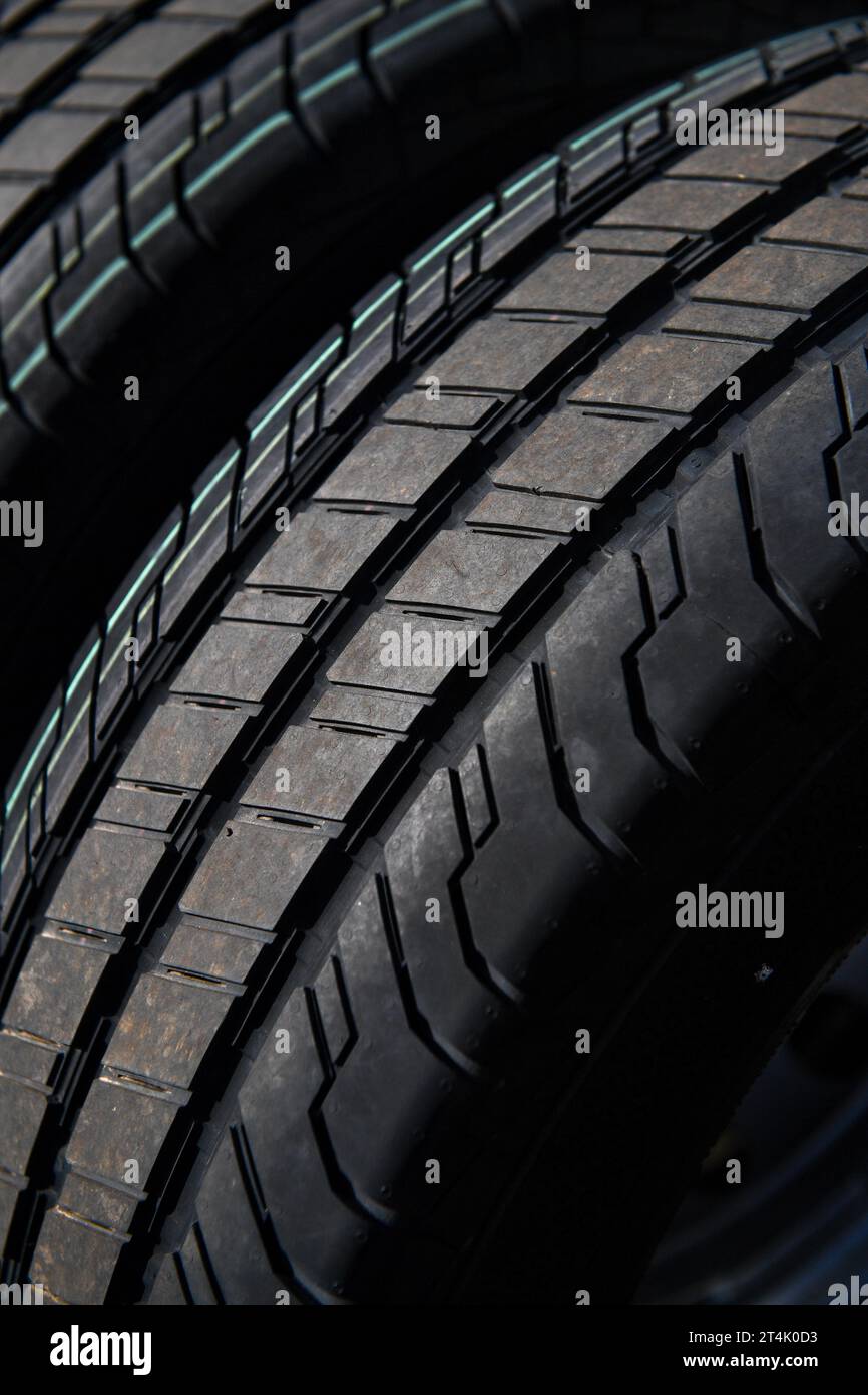Close up of new truck tyres showing deep tread pattern and safety ...