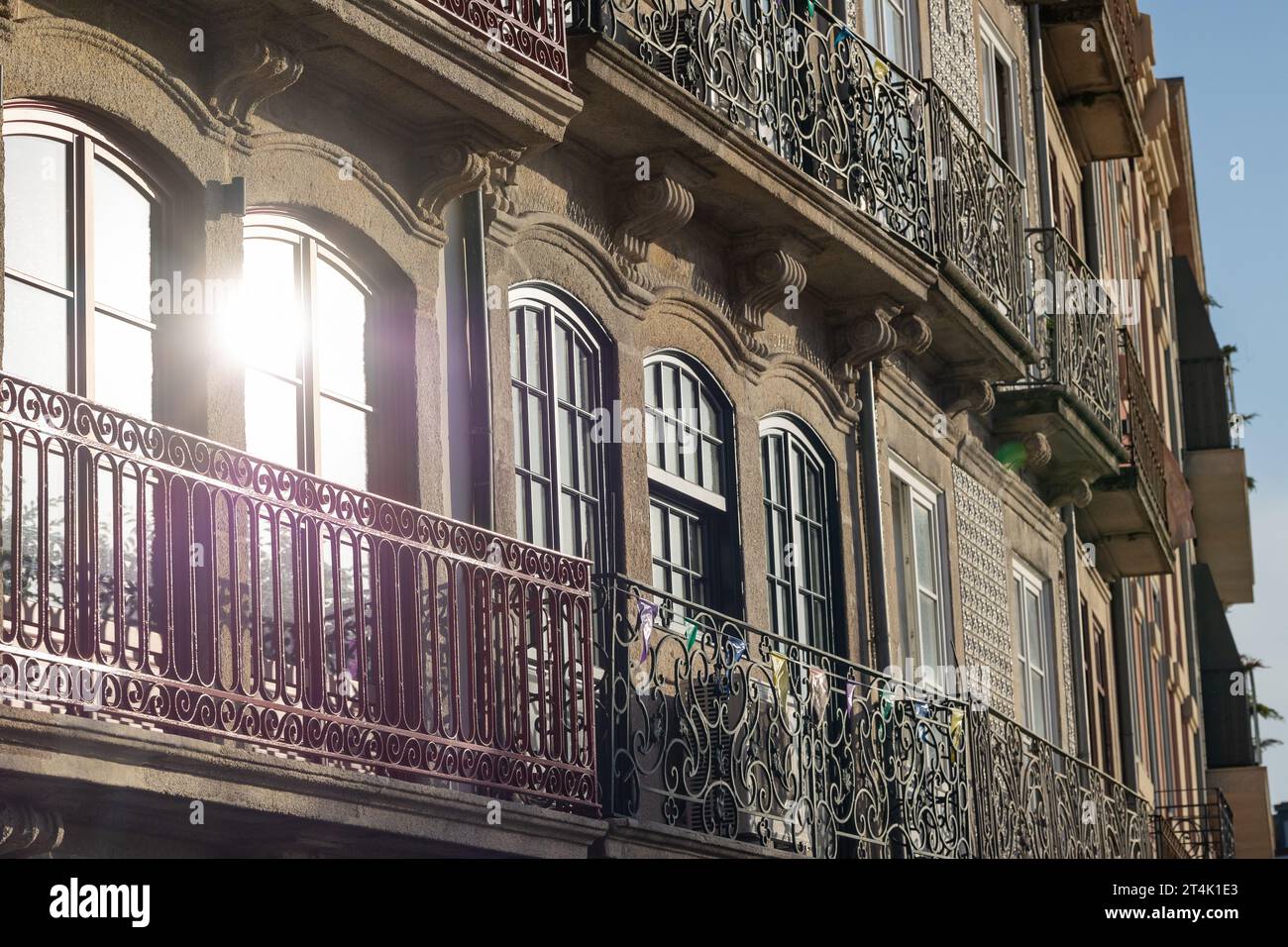 A beautiful, old building with a decorative balcony stands in time ...