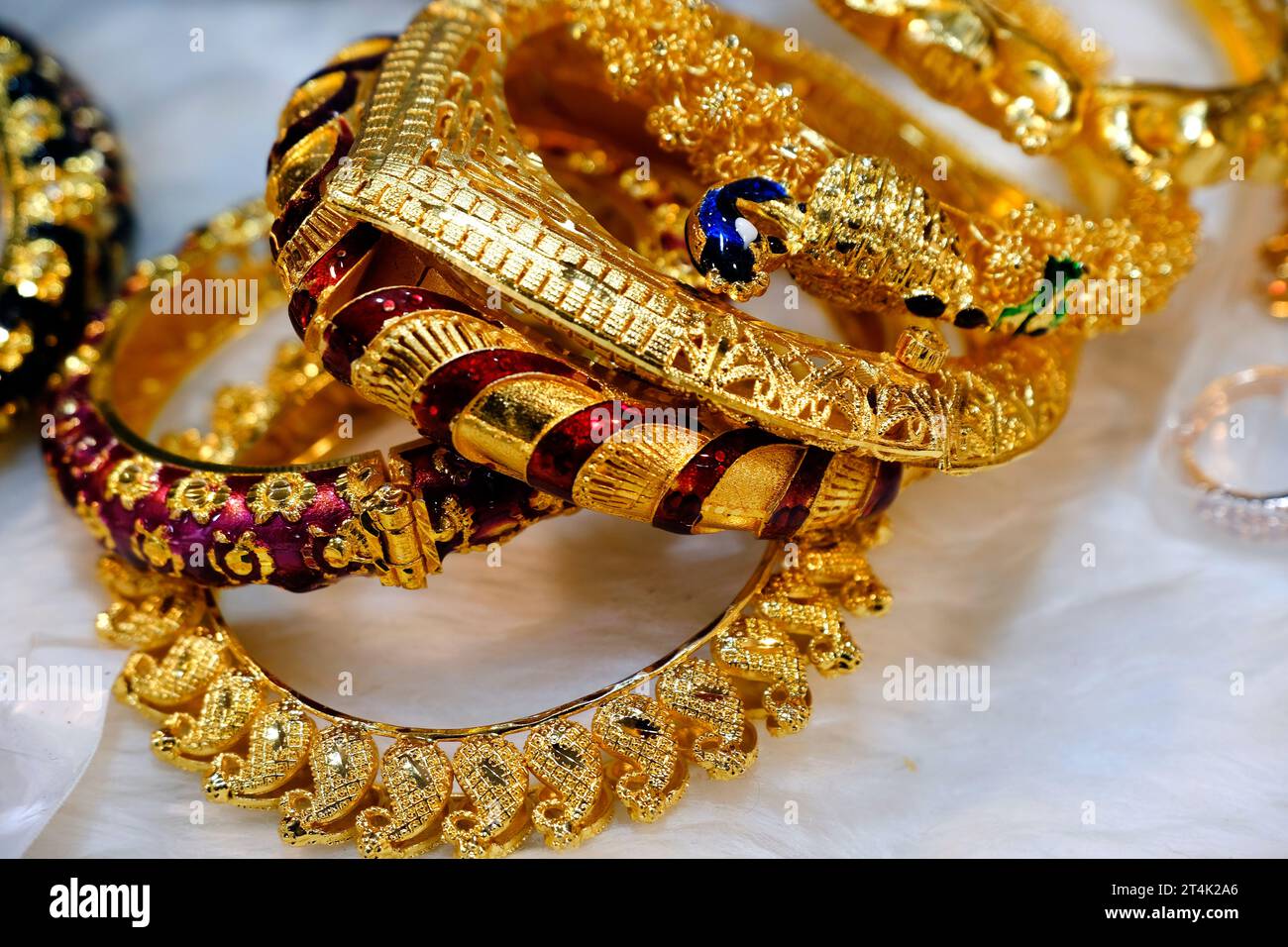 Indian Gold bangles displayed in local shop in a market of Pune, India ...