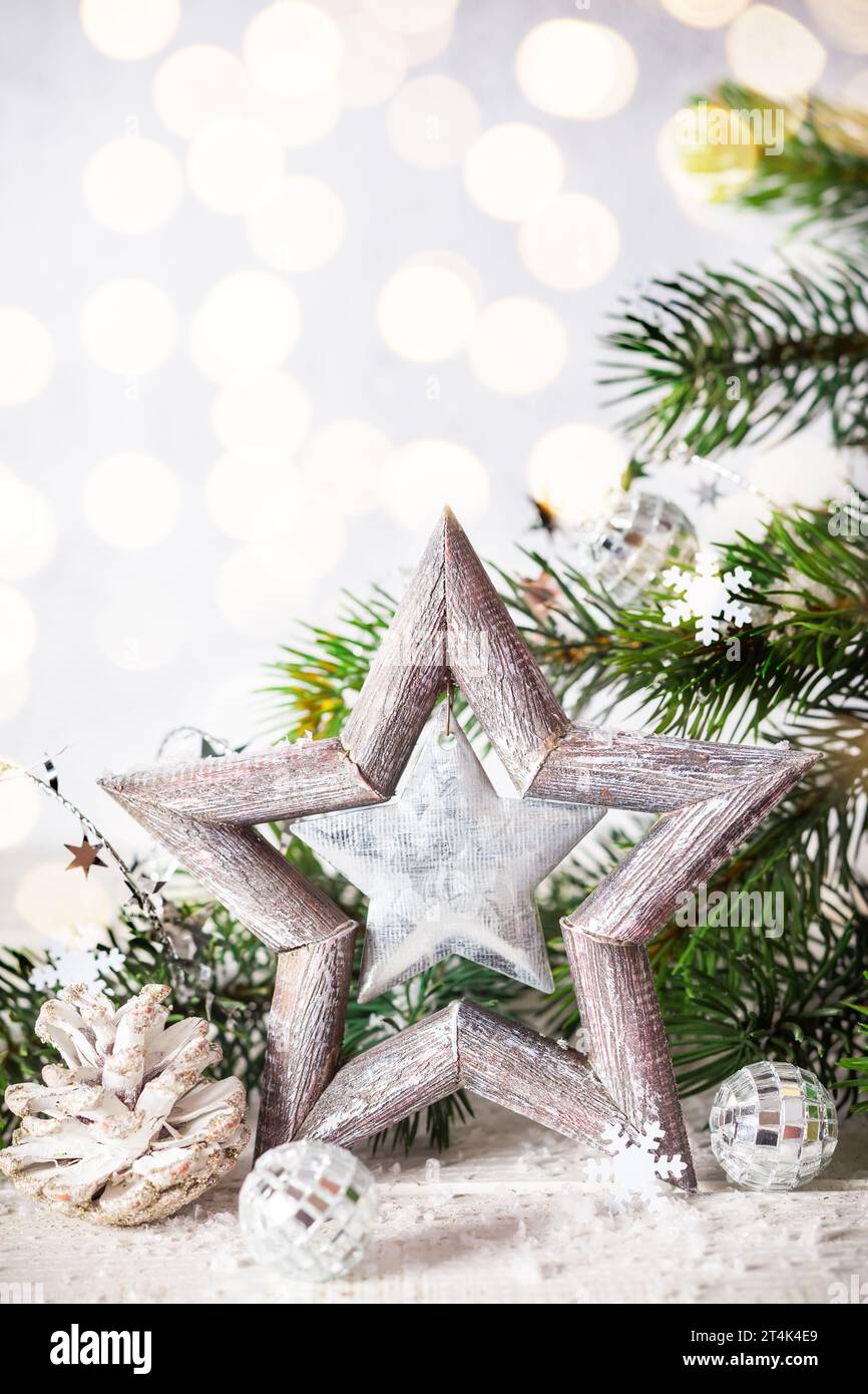 Christmas background with decorative star, fir branches and pine cones ...