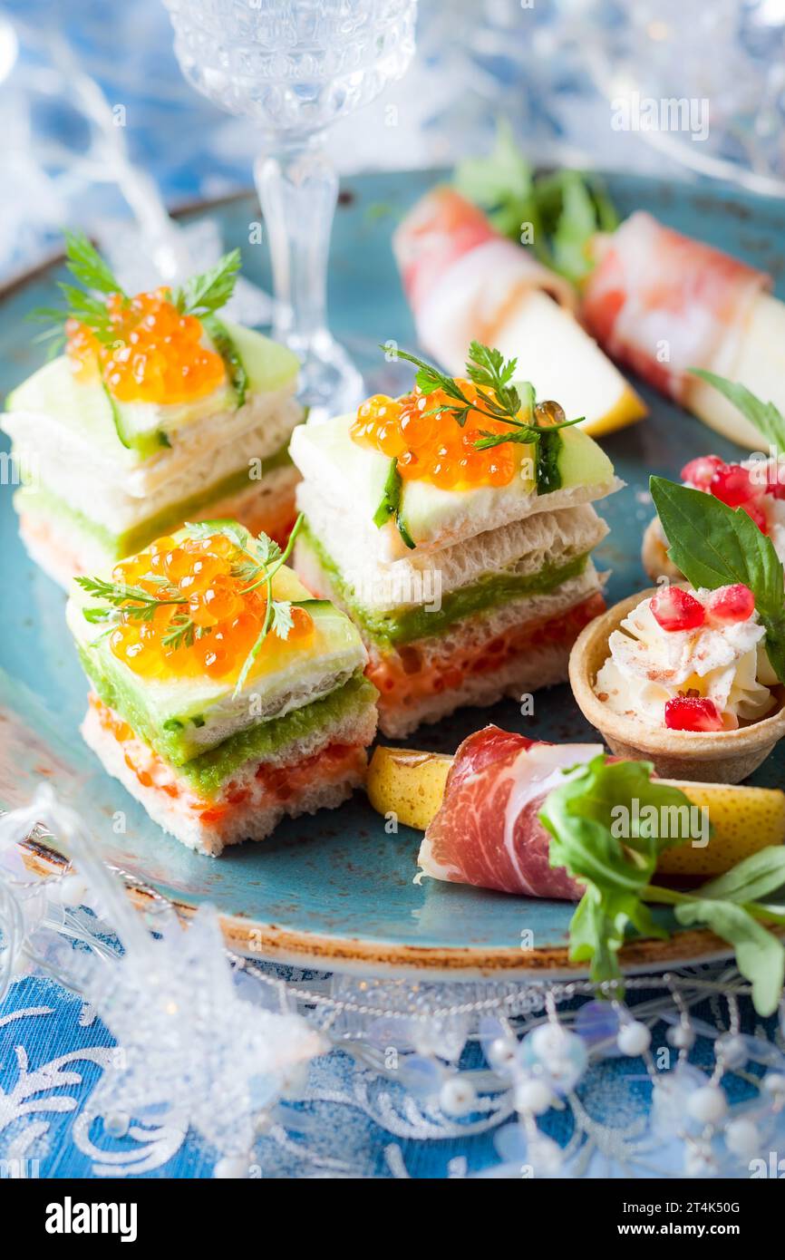 Assortment festive appetizers on the plate Stock Photo - Alamy