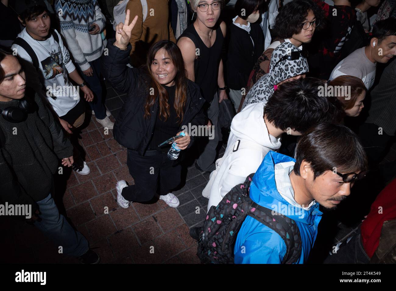 Tokyo, Japan. 31st Oct, 2023. Revelers navigate crowd control barriers ...