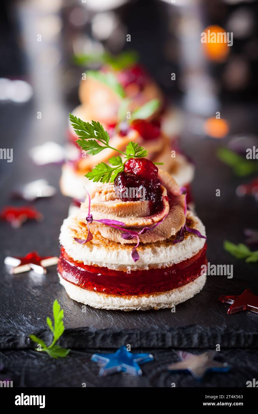 Festive appetizer with foie gras, cranberry chutney and jelly Stock ...