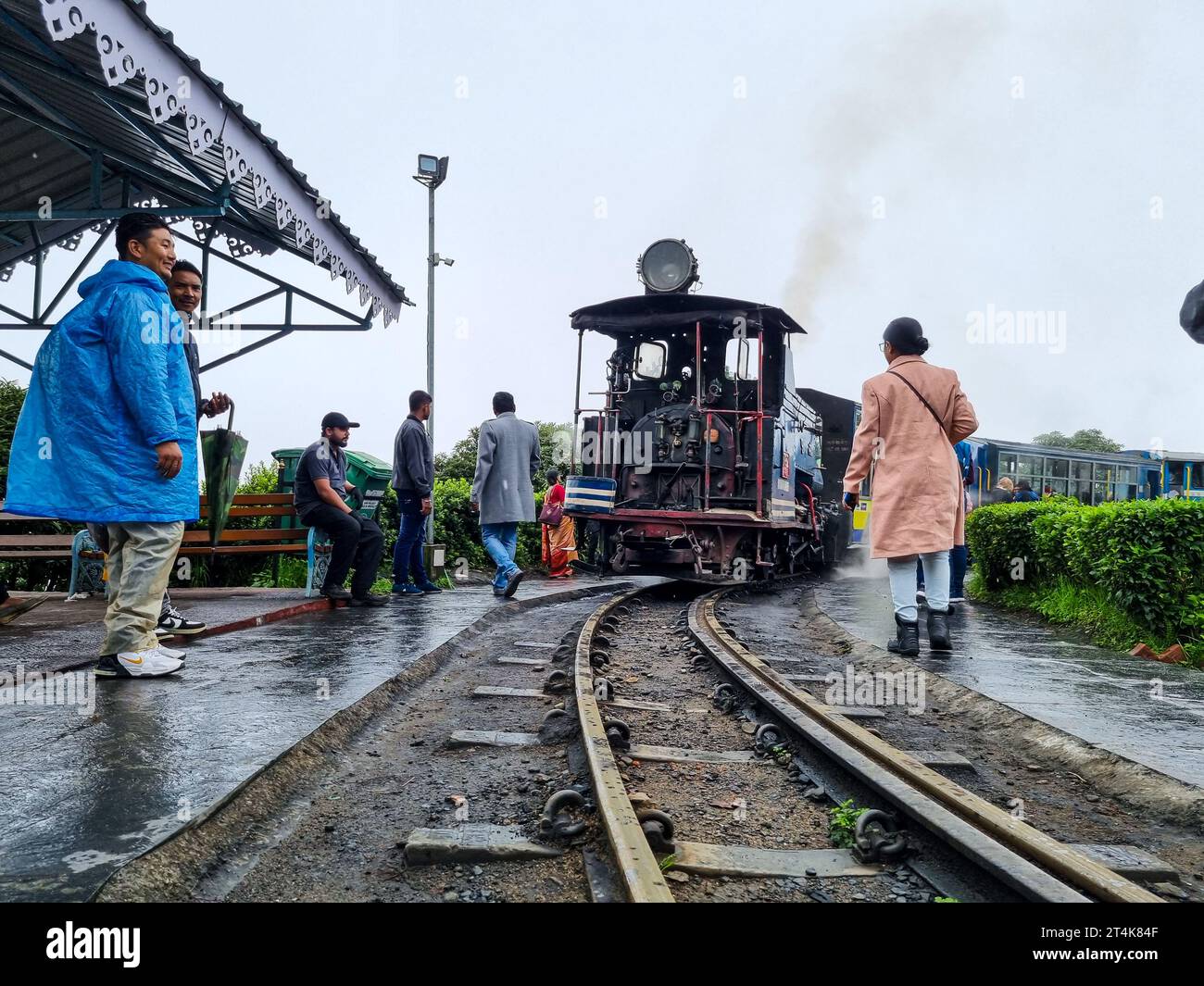Low shot showing people around the tracks of toy train at batista loop ...