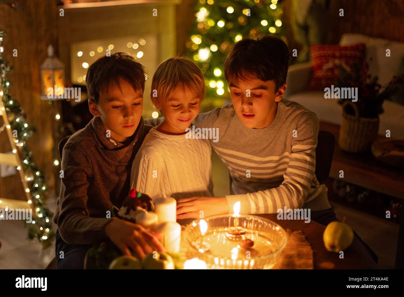 Three children, lighting candles in a nutshell, czech Christmas ...
