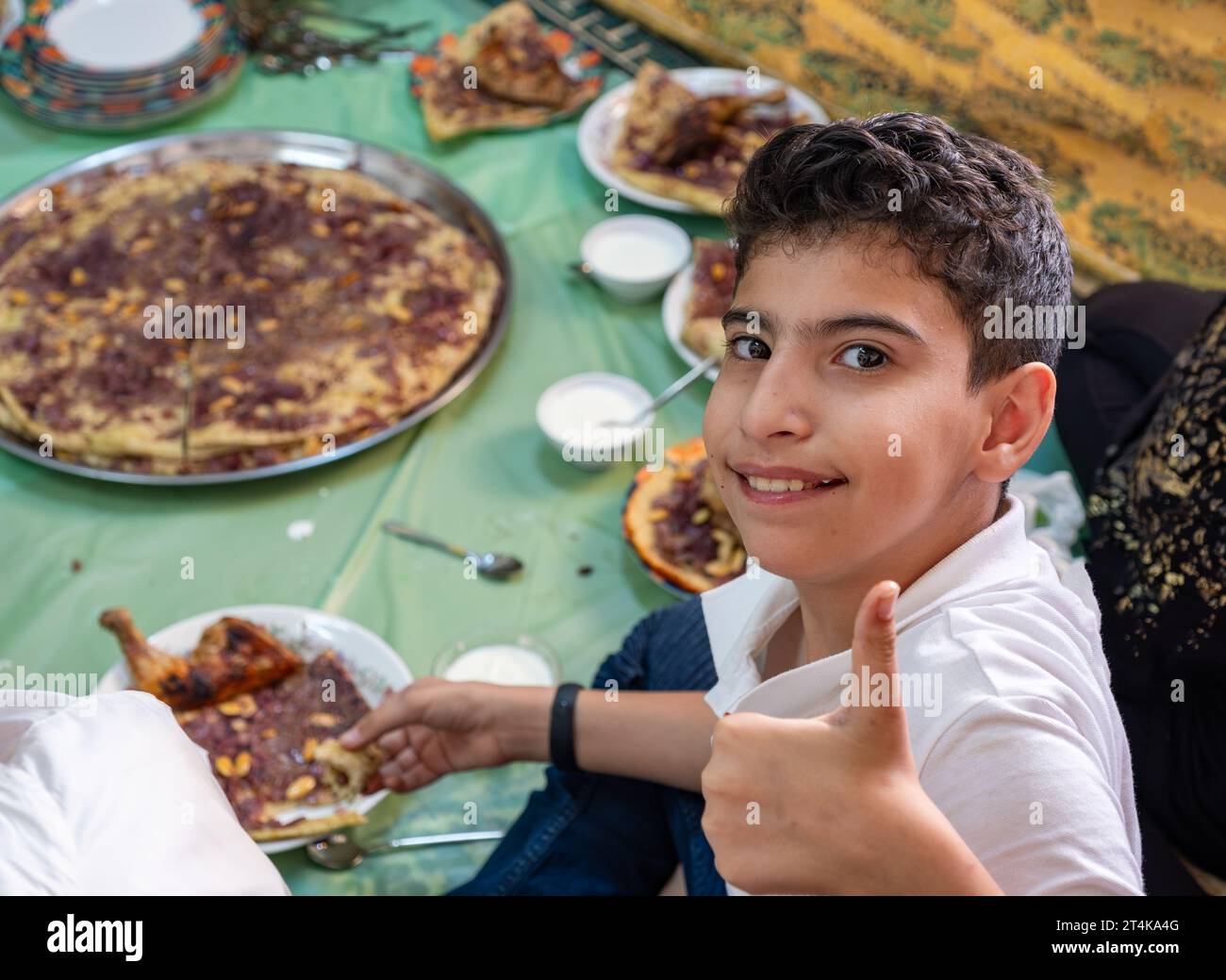 Portrait Of boy making vector gesture or two number with hand while ...