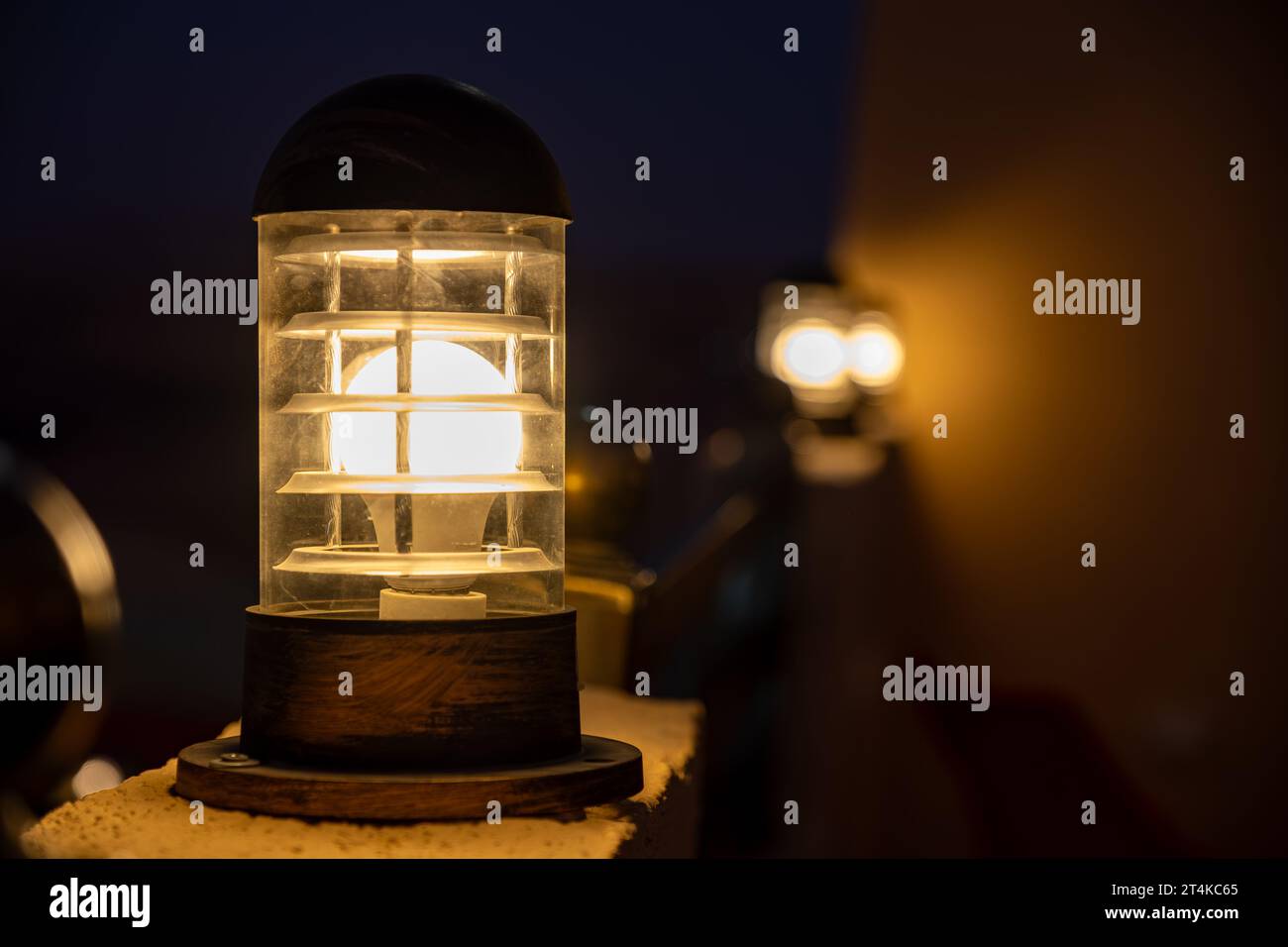 Yellow Led lights on house wall with dark shades during night Stock ...