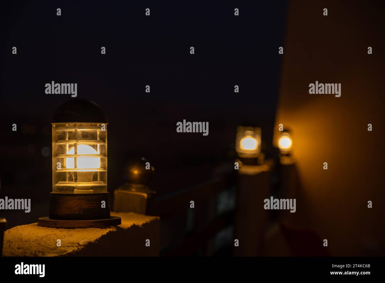 Yellow Led lights on house wall with dark shades during night Stock ...