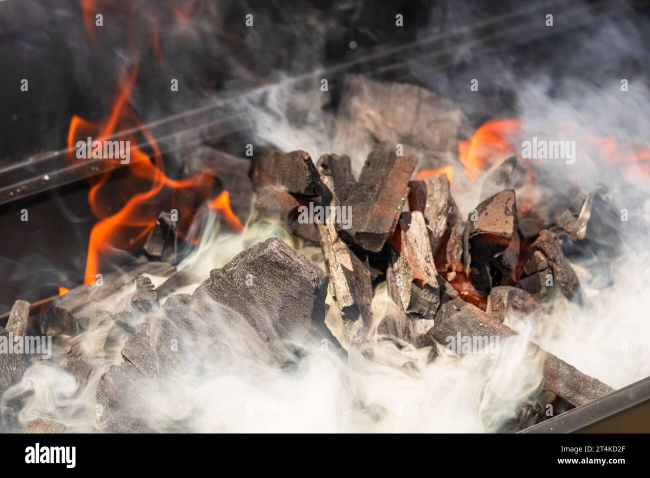 Barbecue grill pit with glowing and flaming hot open fire with red ...