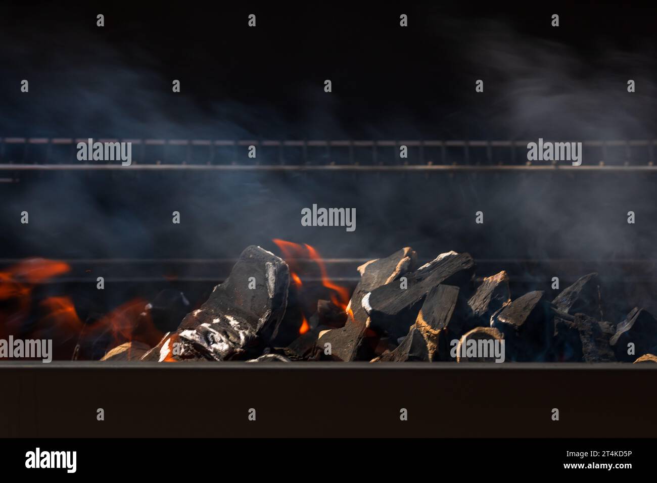 Barbecue grill pit with glowing and flaming hot open fire with red ...