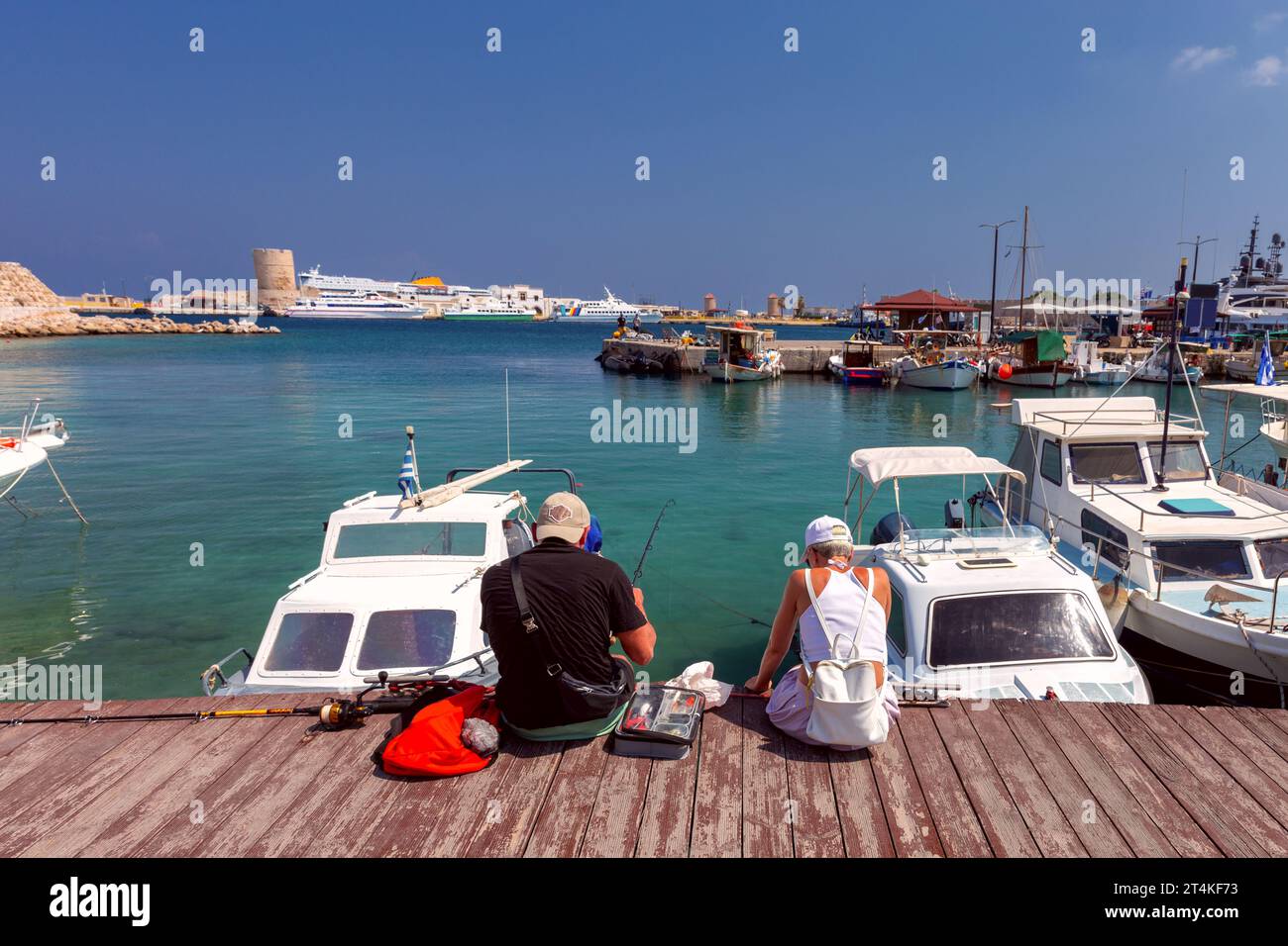 View of traditional wooden fishing boats along the Rhodes waterfront ...