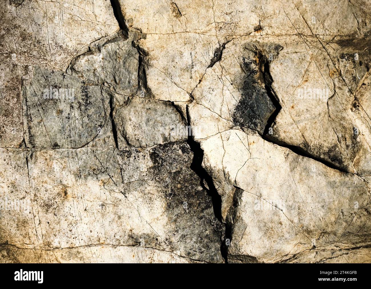 background or texture detail of cracks in cream-colored limestone Stock ...
