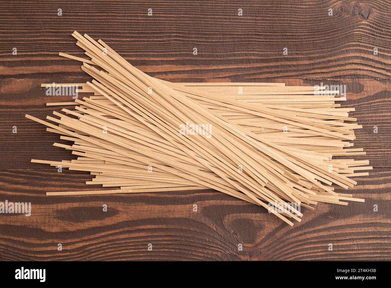 Japanese buckwheat soba noodles on brown wooden background. Side view ...