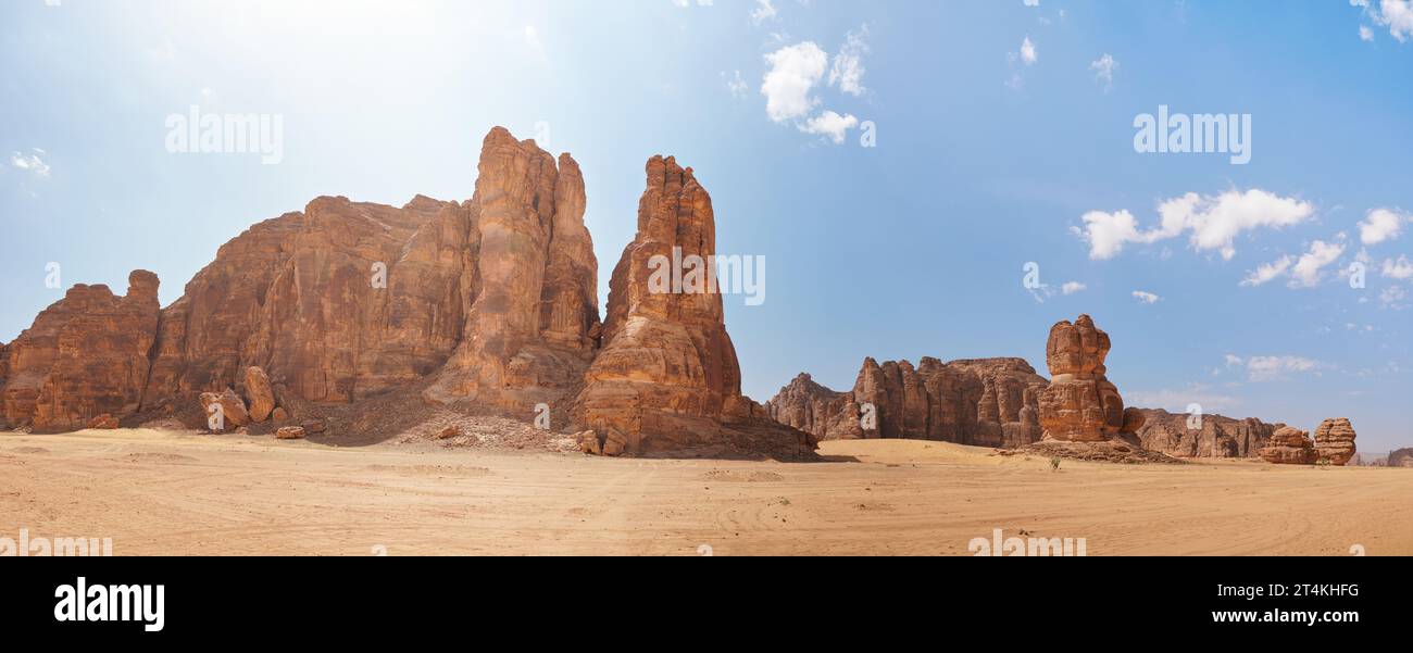 Rocky desert formations with sand in foreground, typical landscape of ...