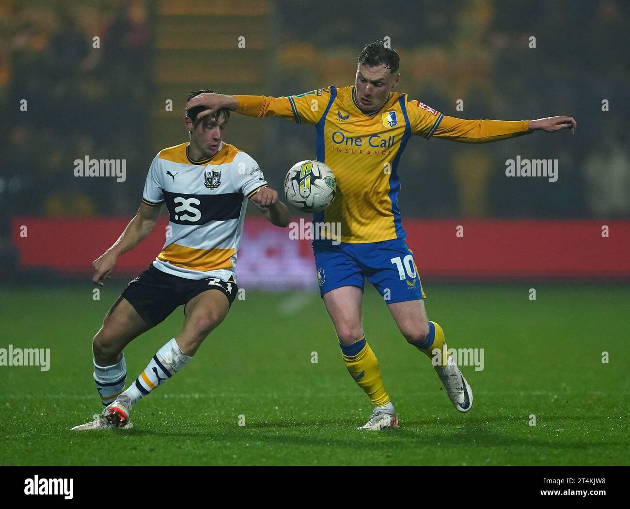 Port Vale's James Plant (left) and Mansfield Town's George Maris battle ...