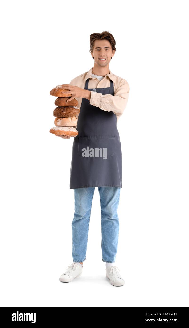 Handsome young man with loaves of fresh bread isolated on white ...