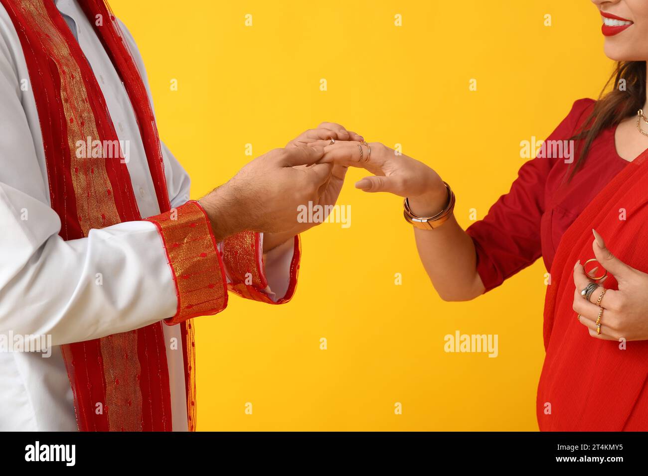 Beautiful Indian couple with engagement rings making proposal to each ...