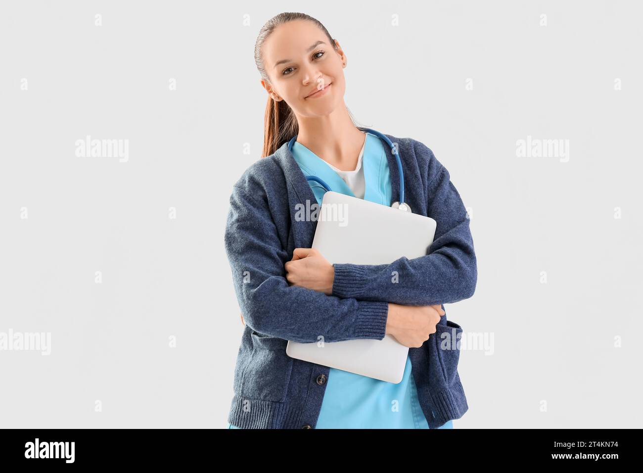Female medical intern with laptop on white background Stock Photo - Alamy