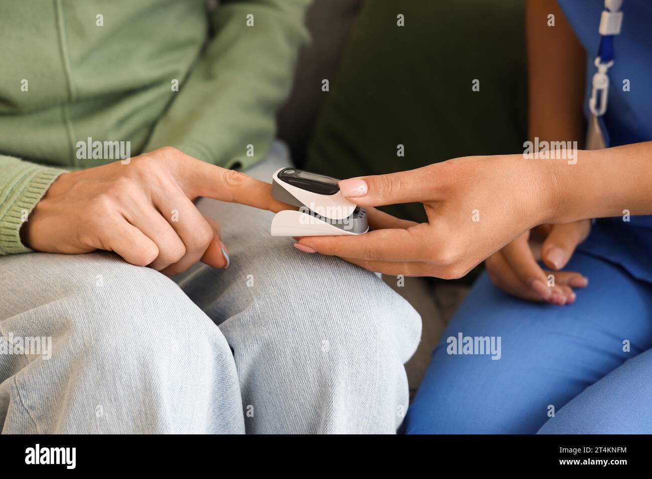 Female doctor taking pulse from patient at home, closeup Stock Photo ...