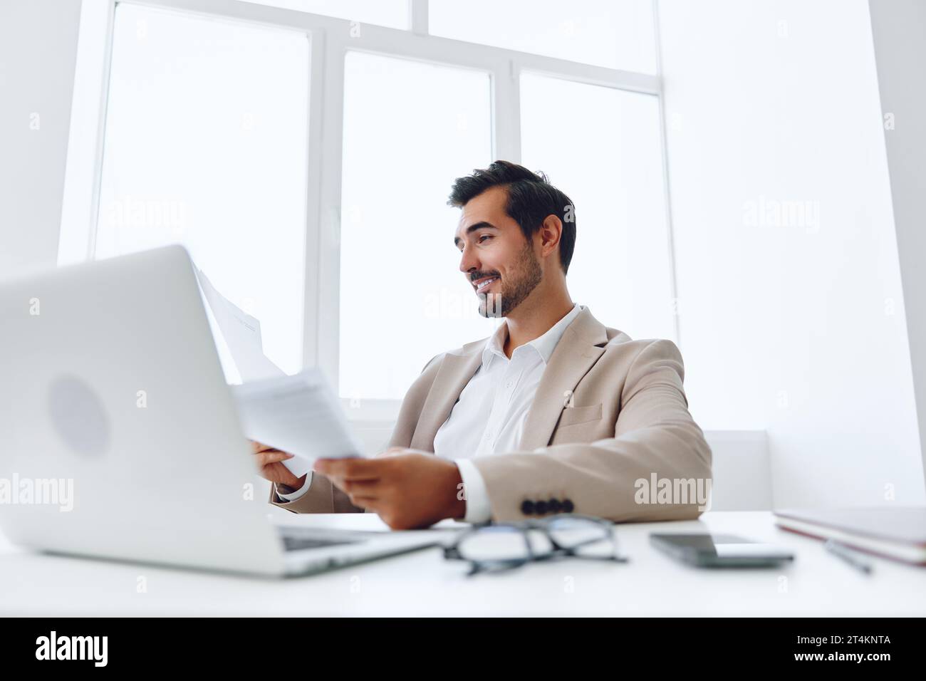 Paper planning office holding businessman Stock Photo - Alamy