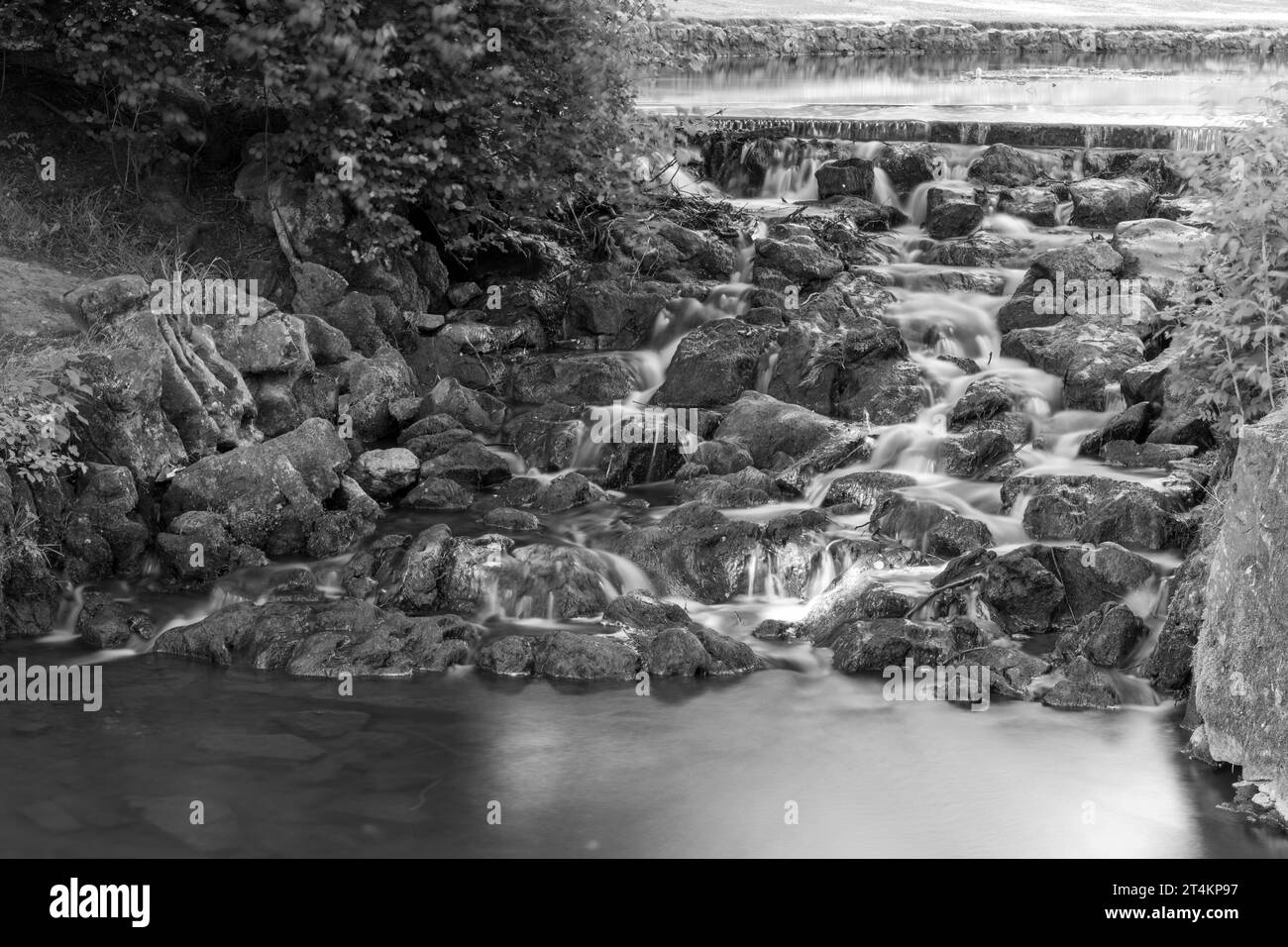 Long exposure of a waterfall flowing through Buxton Pavilion Gardens in ...