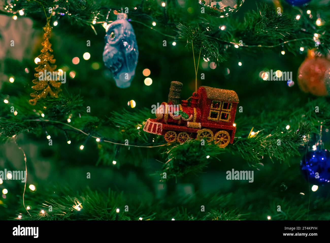 New Year's tree with decorations and toys on the holiday evening ...