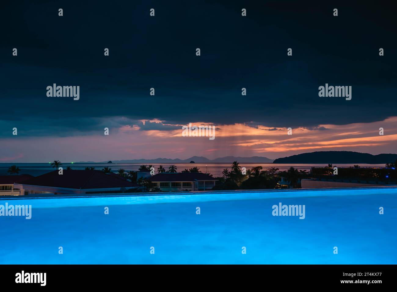 Dramatic Tropical Sunset In Thailand View Over Roof Top Swimming Pool