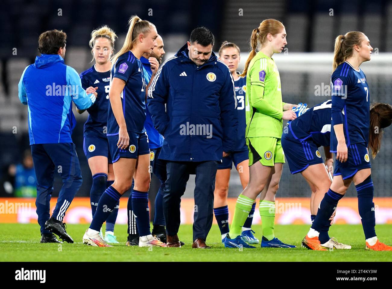 Scotland head coach Pedro Martinez Losa (centre) looks dejected ...